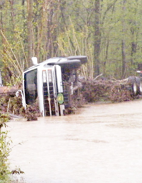 Woman rescued from floodwaters that destroyed home - Harrison Daily
